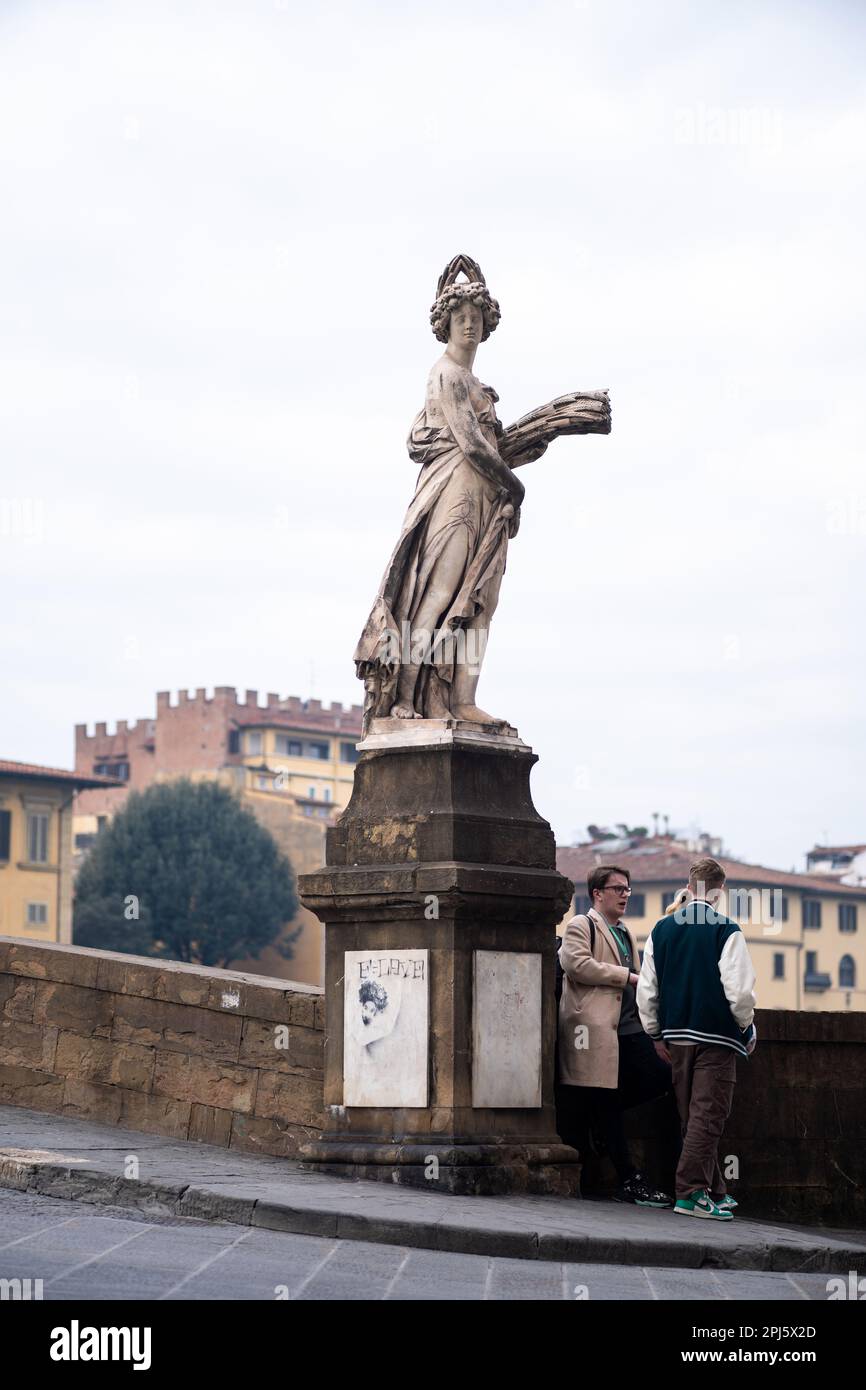 Statue of summer on Ponte Santa Trinita over the River Arno, Florence ...