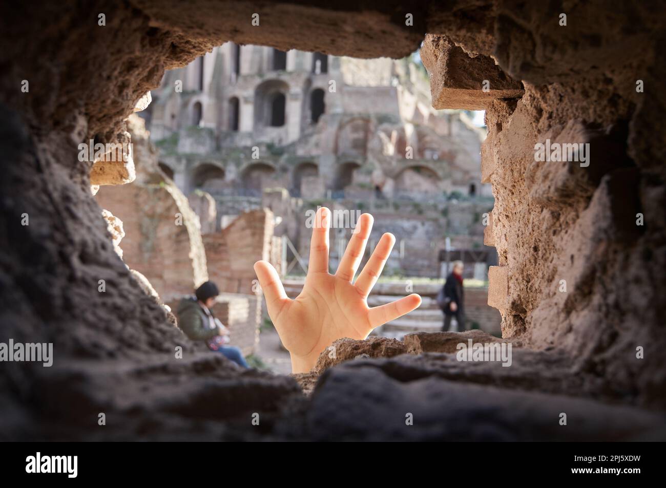 Child´s hand through a hole in the ruins of the roman forum Stock Photo ...