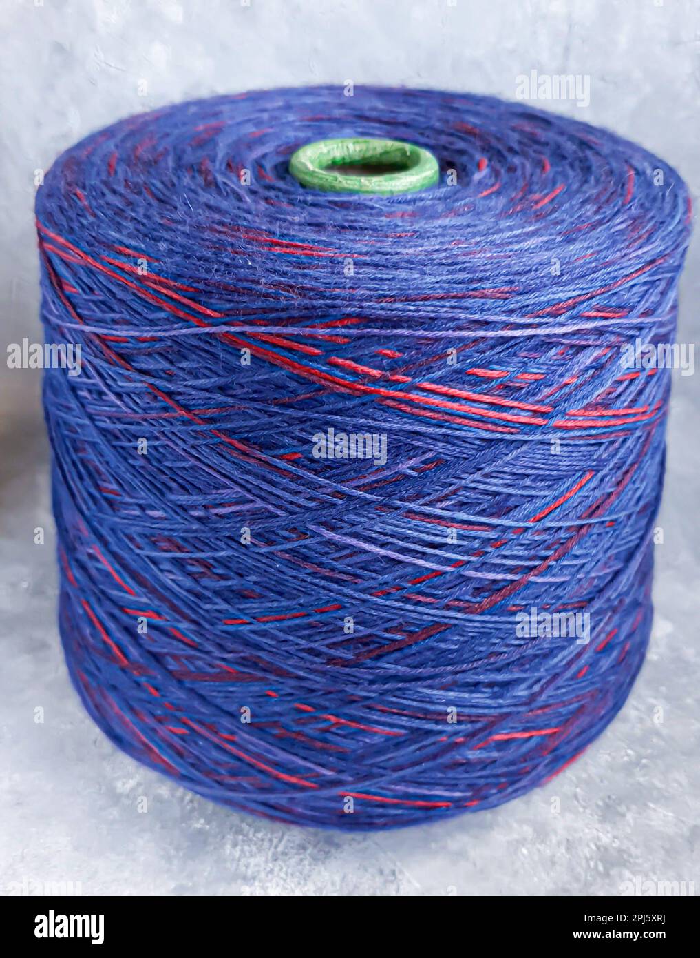 Handmade knitting pattern. Knitted fabric from a multi-colored thread ...