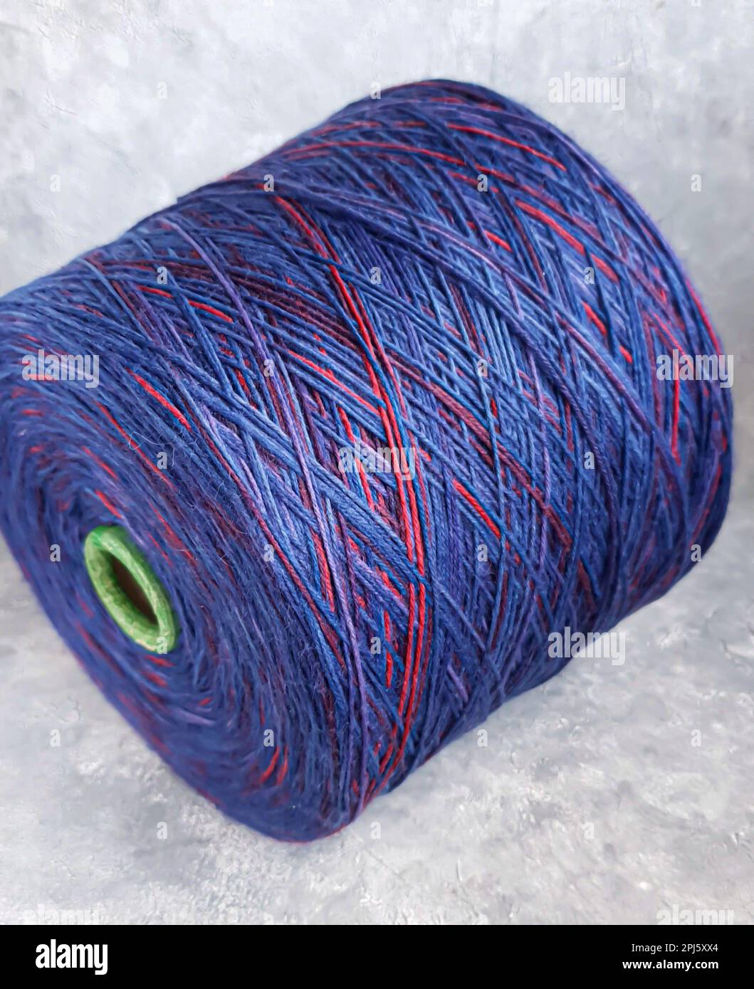 Handmade knitting pattern. Knitted fabric from a multi-colored thread ...