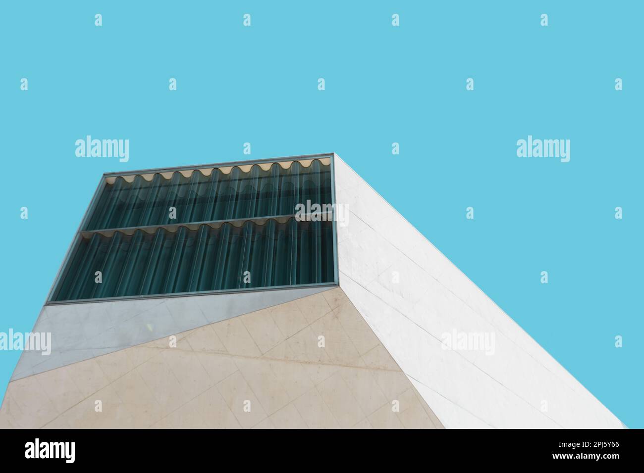 A modern building fragment isolated on a blue background Stock Photo ...