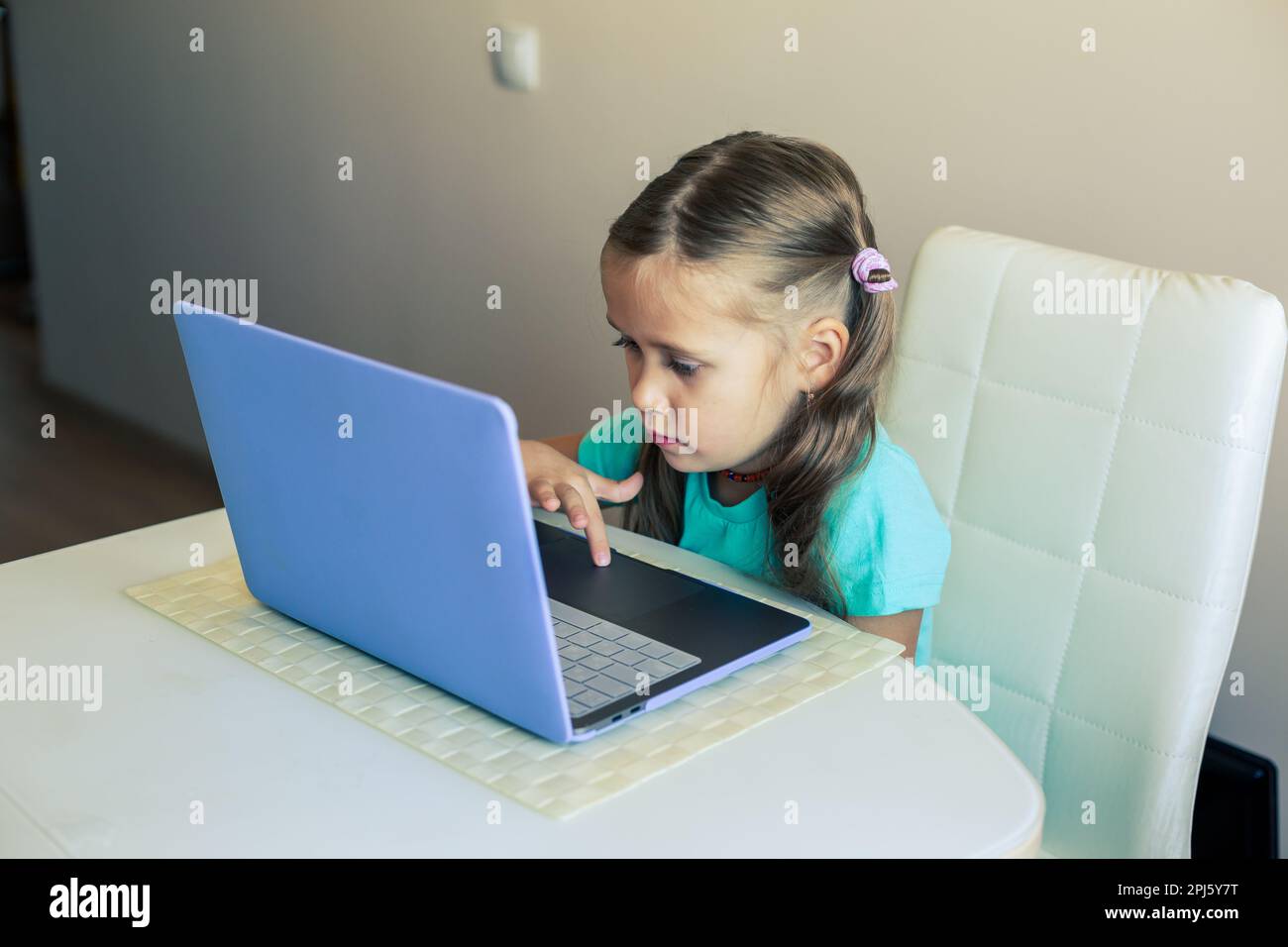 Little cute girl uses laptop to have video call Stock Photo - Alamy