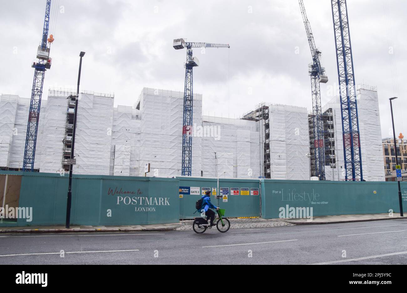 London, UK. 31st Mar, 2023. A cyclist passes by the Postmark ...