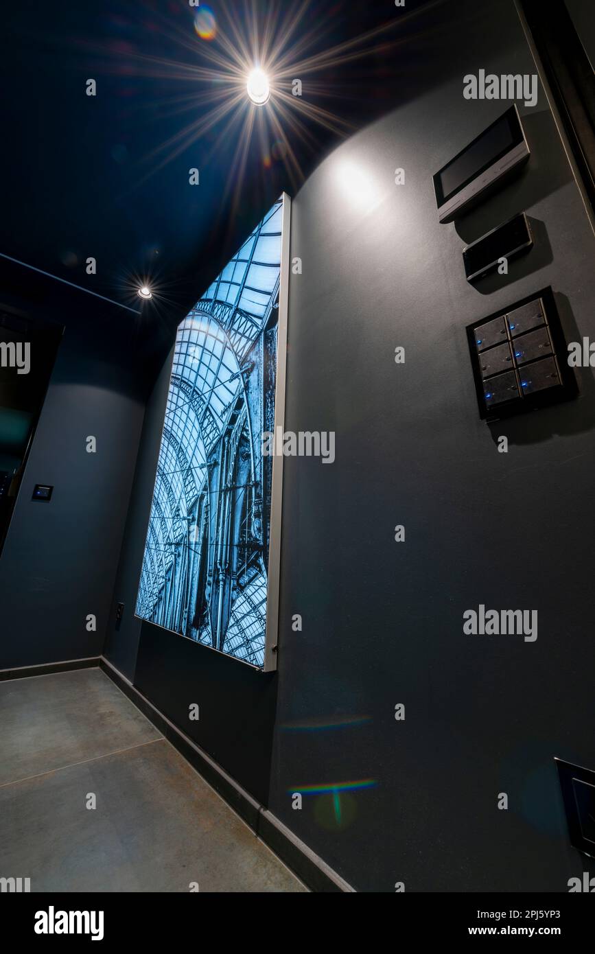 Illuminated Poster Hanging on the Wall in Switzerland Stock Photo - Alamy