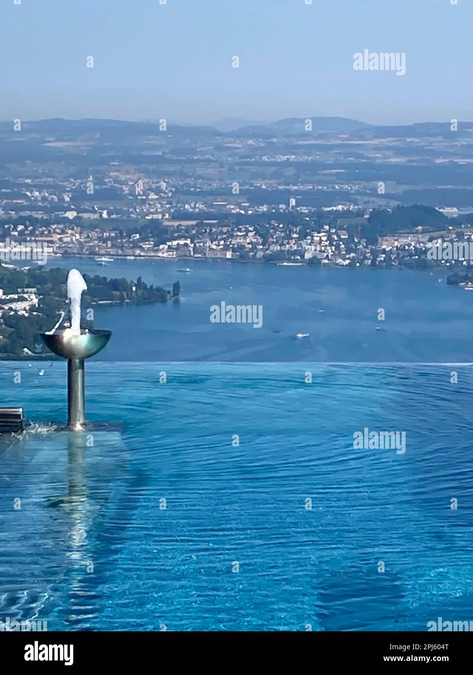 Infinity Swimming Pool with Mountain and Lake Lucerne View in a Sunny ...