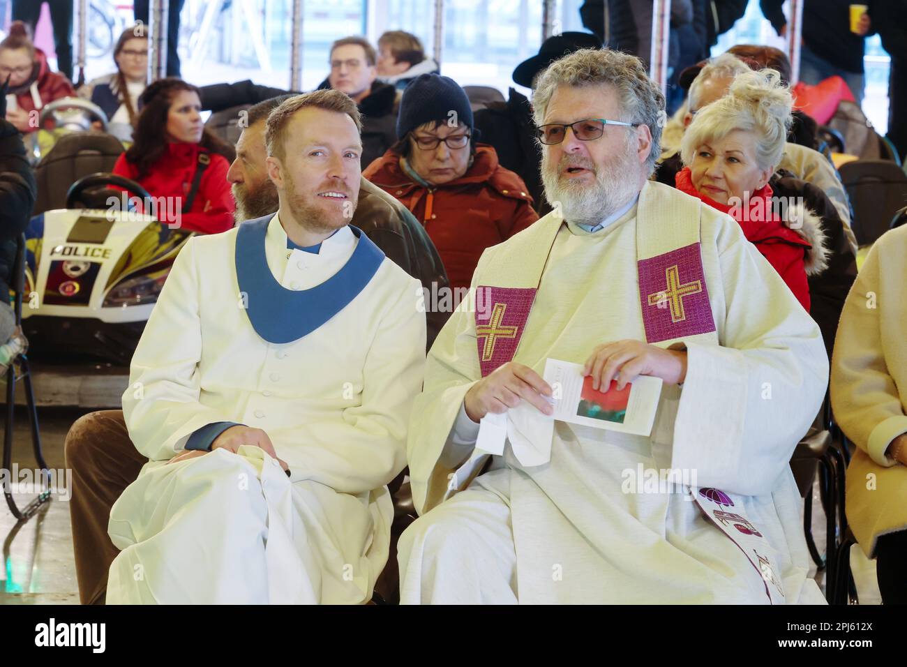 Erfurt, Germany. 31st Mar, 2023. Pastor Klaus Zebe (l) sits next to his ...
