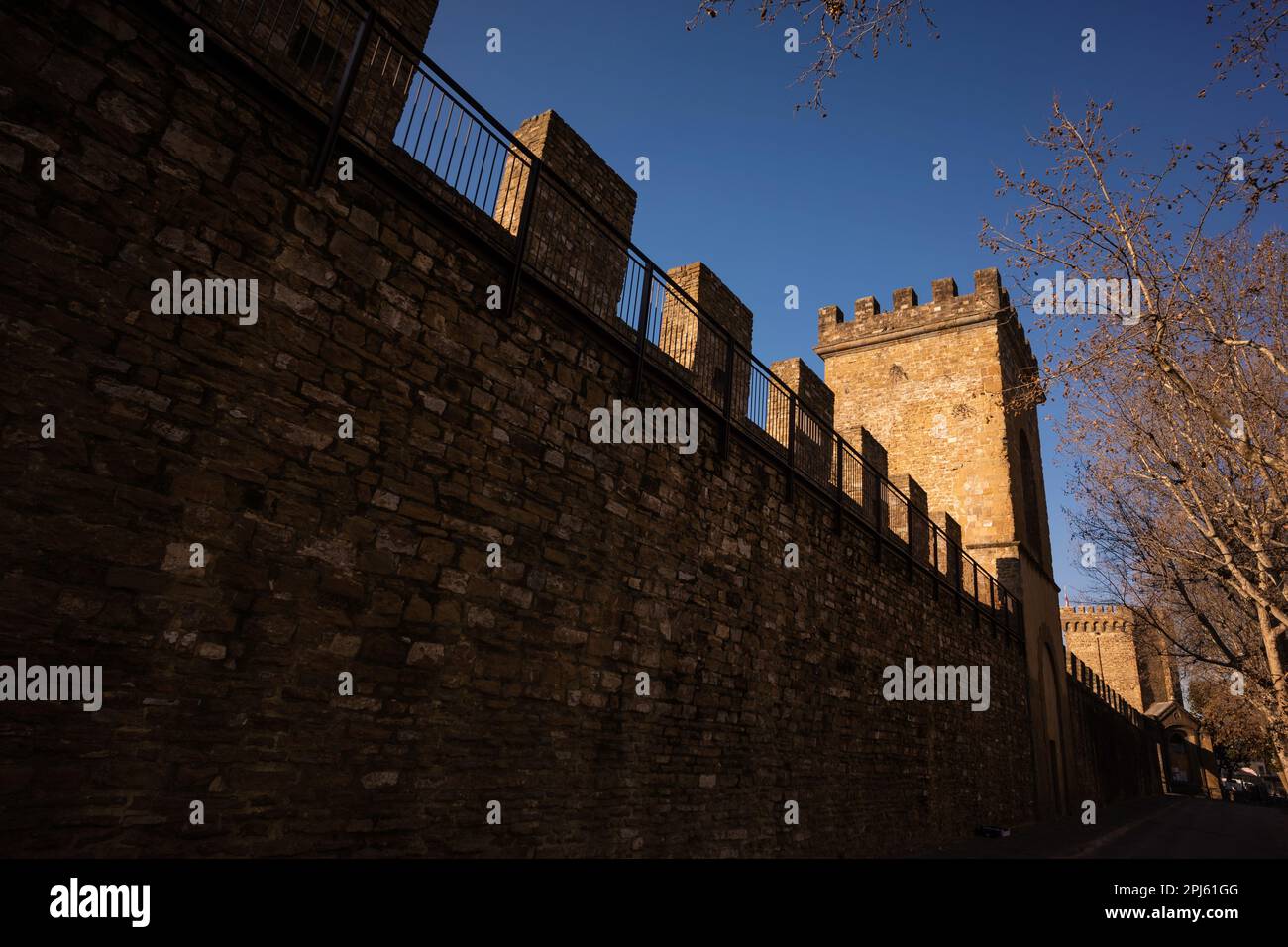 City walls and opening near Torrino di Santa Rosa, beside the river ...