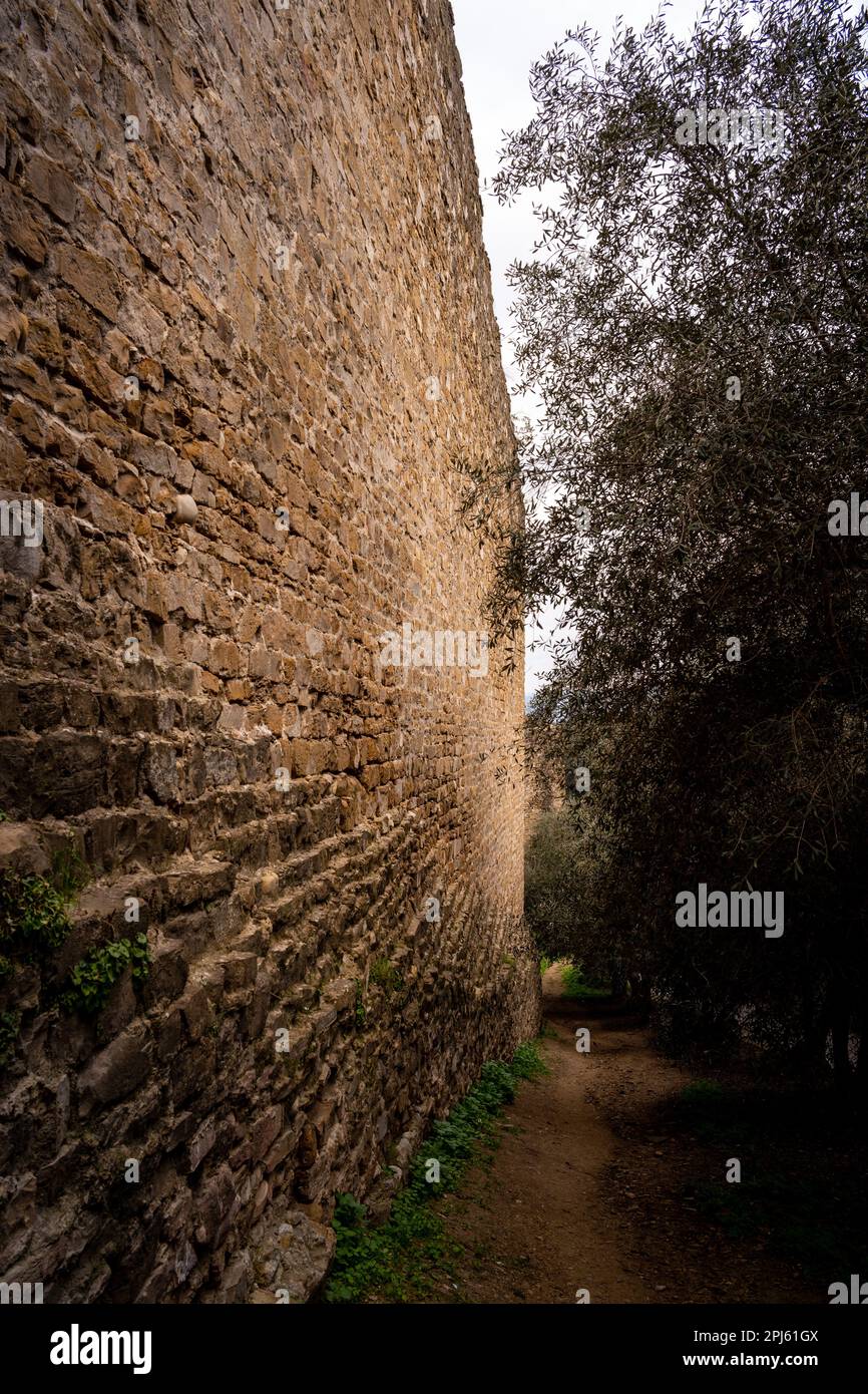 Surviving ancient city walls of Florence on Via di Belvedere around the ...