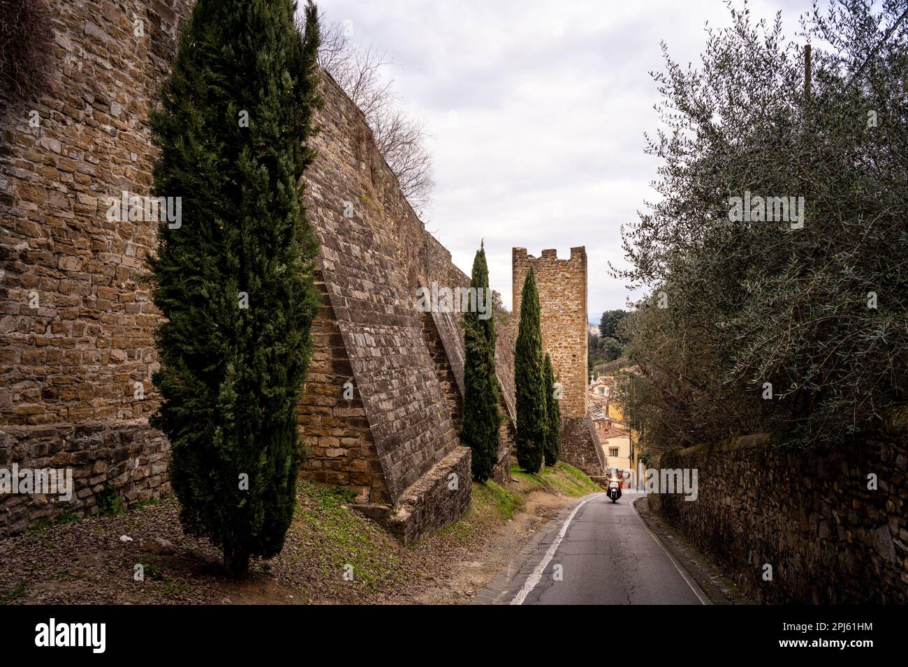 Surviving ancient city walls of Florence on Via di Belvedere around the ...
