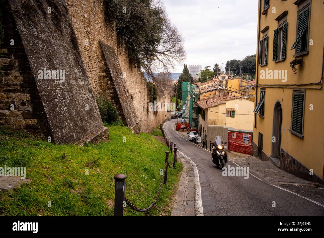 Surviving ancient city walls of Florence on Via di Belvedere around the ...