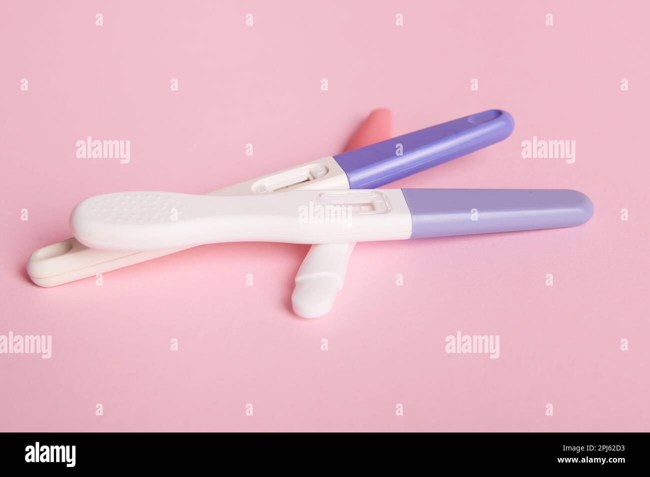 Pregnancy test kits with two bars on isolated pink pastel background ...
