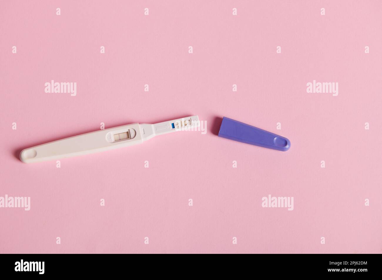 Still life. Inkjet pregnancy test with positive result, isolated on ...