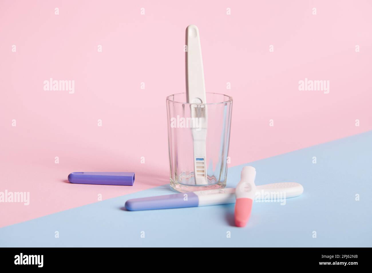 Pregnancy tests for quick pregnancy detection on pink and blue pastel ...