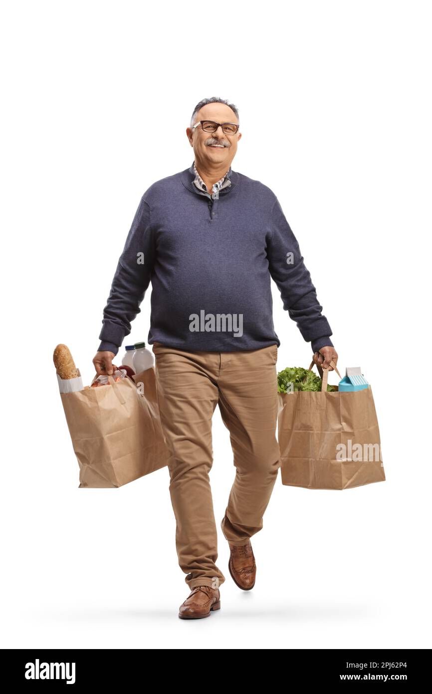 Full length portrait of a mature man carrying grocery bags isolated on ...