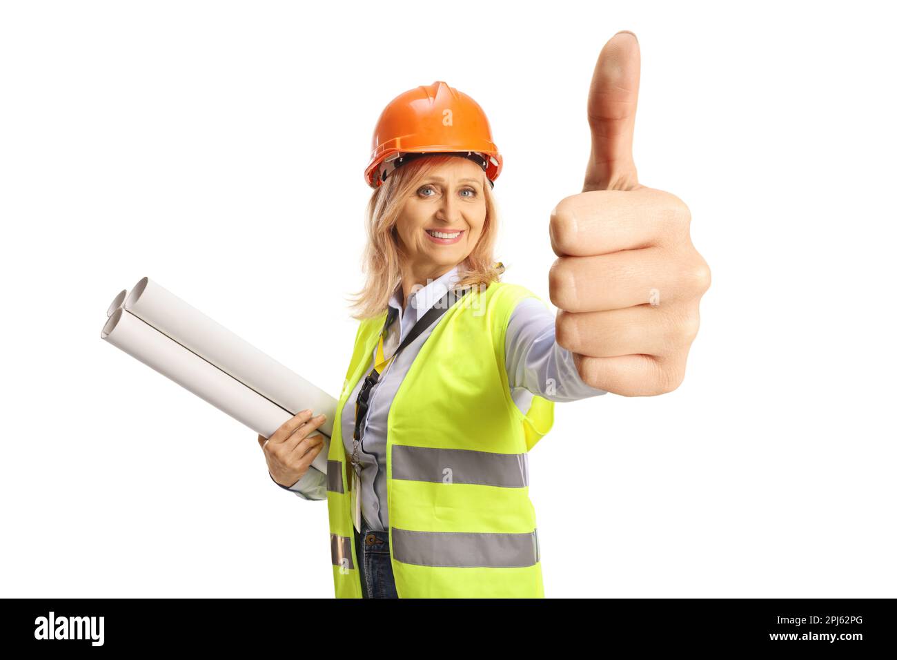 Smiling female engineer with a safety vest and hardhat holding blueprints and gesturing thumbs ...