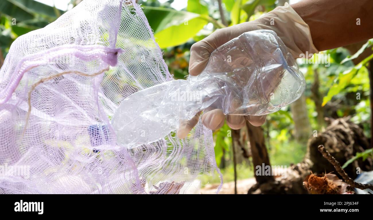 People put plastic bottles in garbage bags. agriculture and climate ...