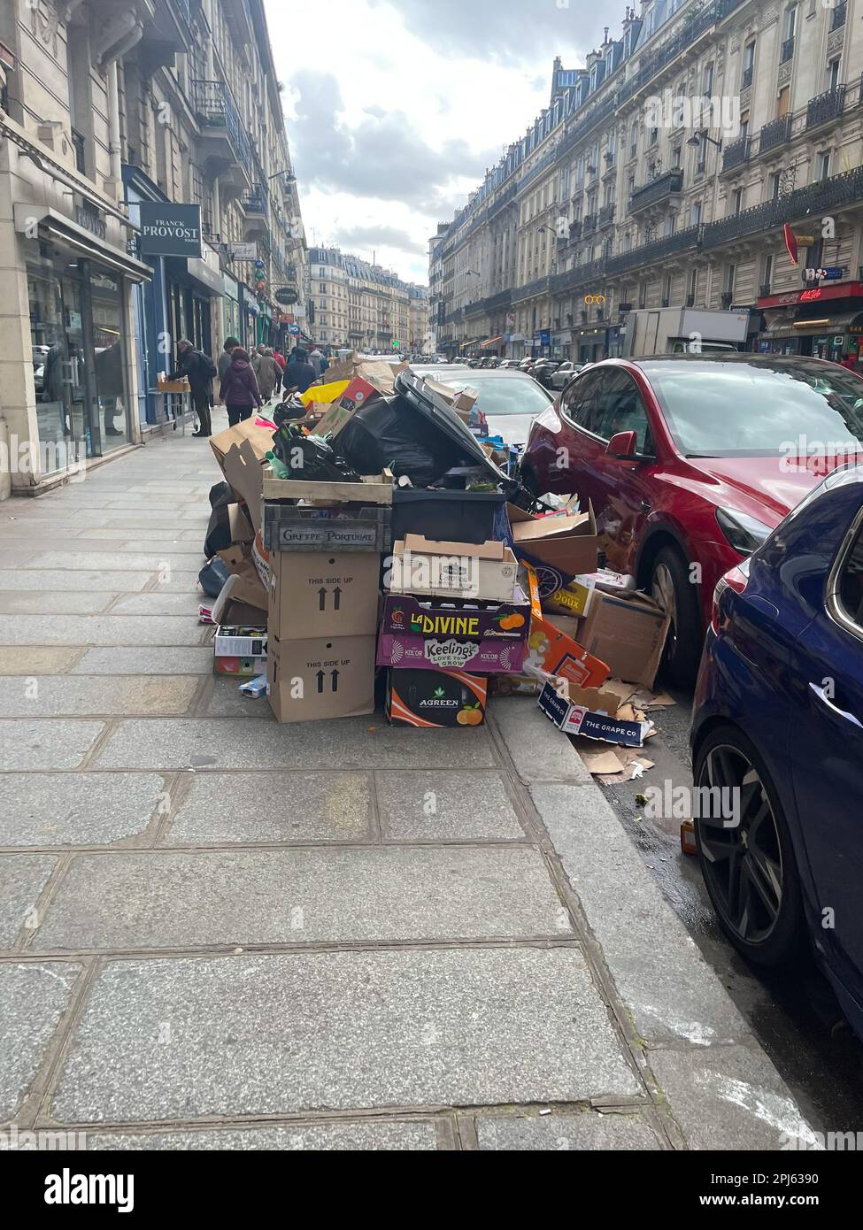 Paris, France. March 21. 2023. Garbage cans piling up in the street due ...