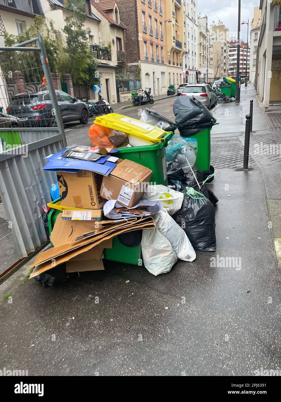 Paris, France. March 21. 2023. Garbage cans piling up in the street due ...