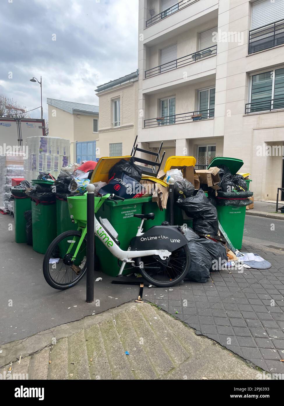Paris, France. March 21. 2023. Garbage cans piling up in the street due ...