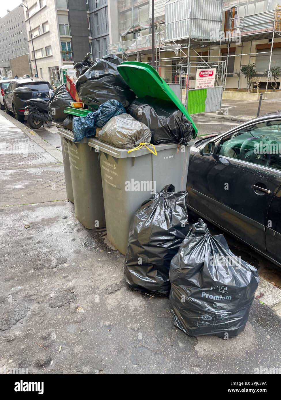 Paris, France. March 21. 2023. Garbage cans piling up in the street due ...