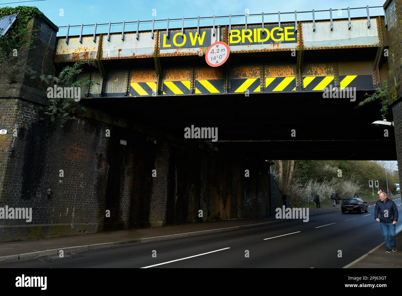 Low railway bridge over a road at at Kettering, England Stock Photo - Alamy