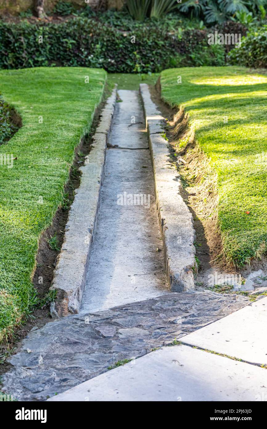 Narrow irrigation canal for runoff water or concrete drainage in ...