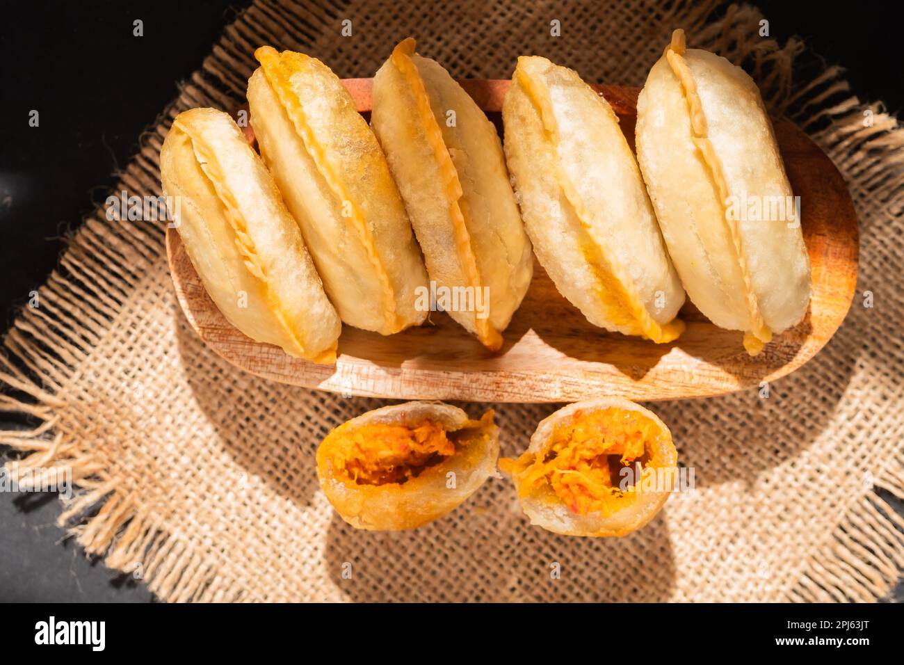 Cireng with chicken filling in a wooden bowl. Cireng is a traditional ...