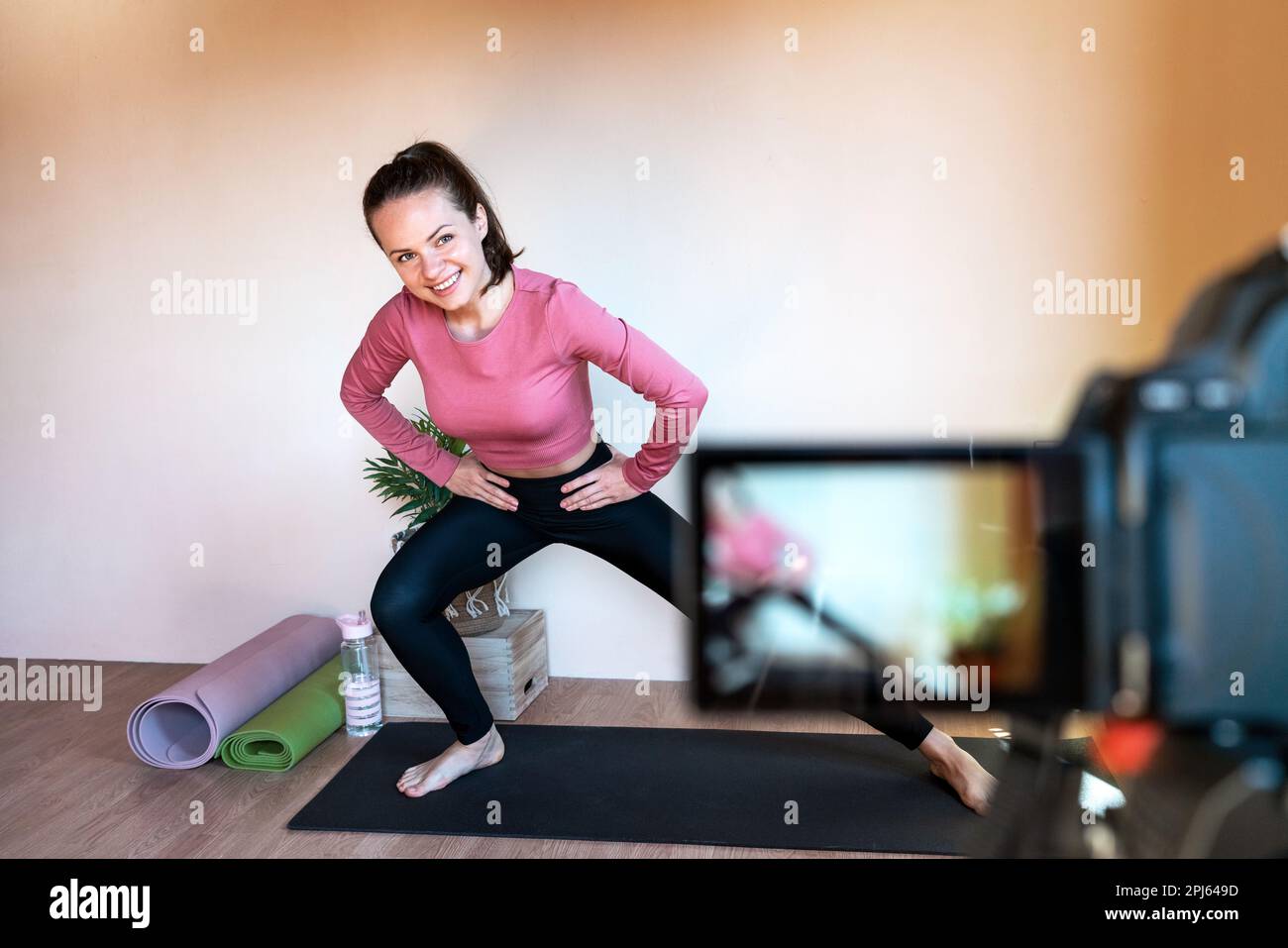 Young woman streaming video using hi-res stock photography and images ...