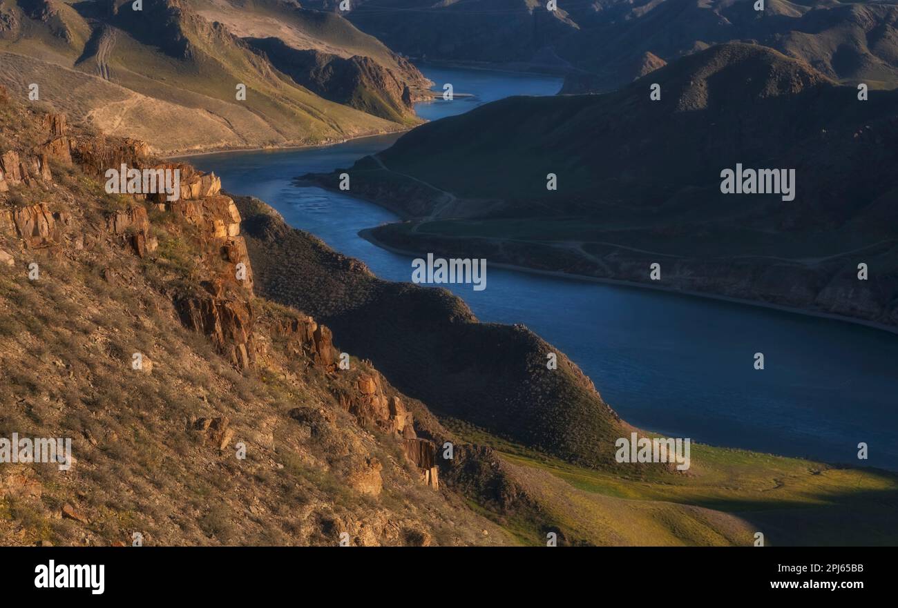 Ili river canyon with blue water. river flows among the beautiful hills ...