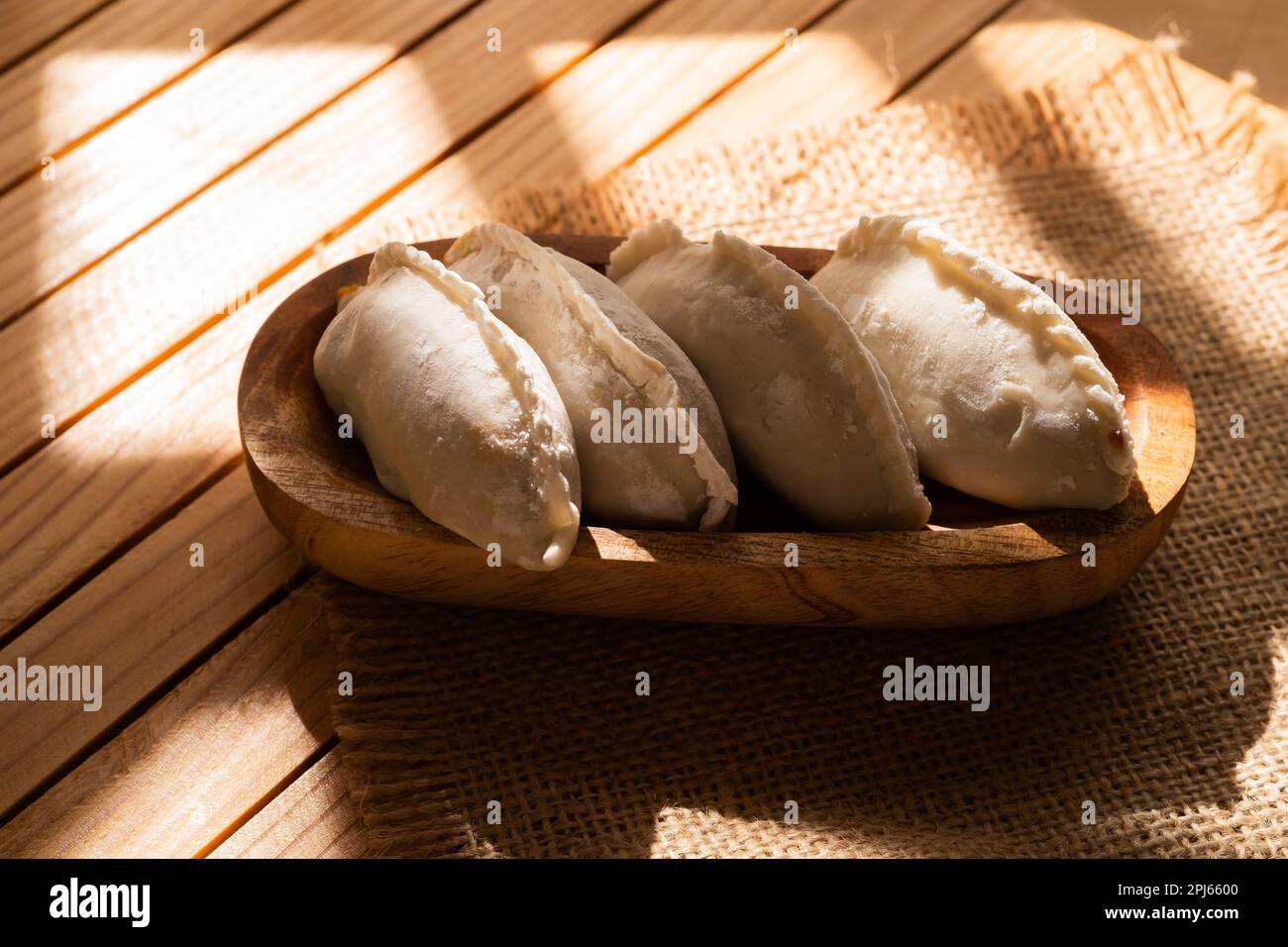 Cireng with chicken filling in a wooden bowl. Cireng is a traditional ...