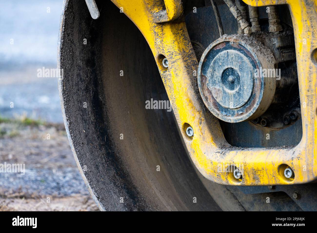 Detail view of the drum of a large compactor Stock Photo - Alamy