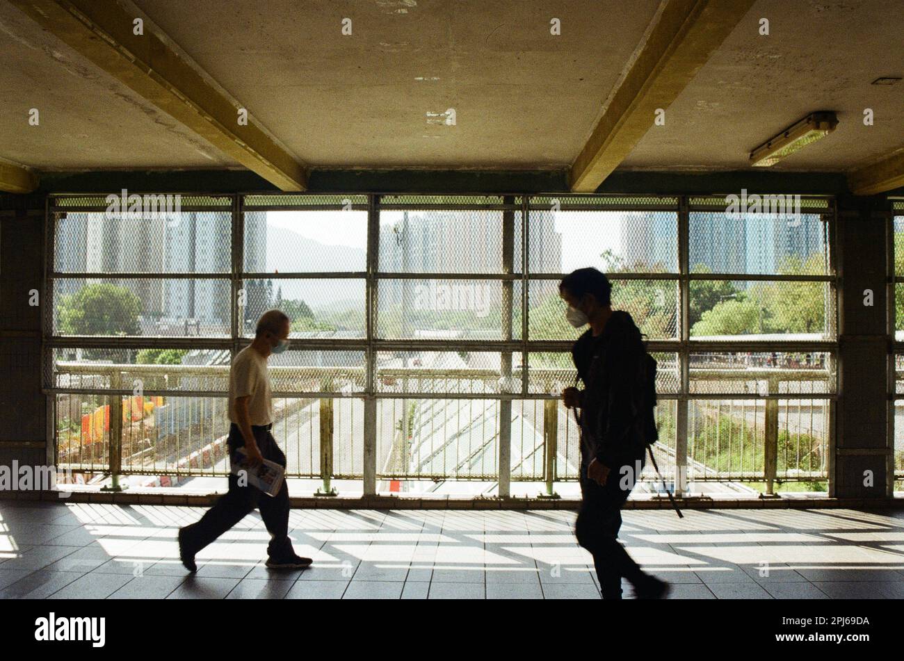 Two people walking opposite directions hi-res stock photography and ...