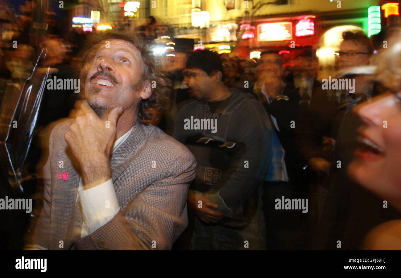 Artist Brian Goggin watches as one of the last cloth book covers fall ...