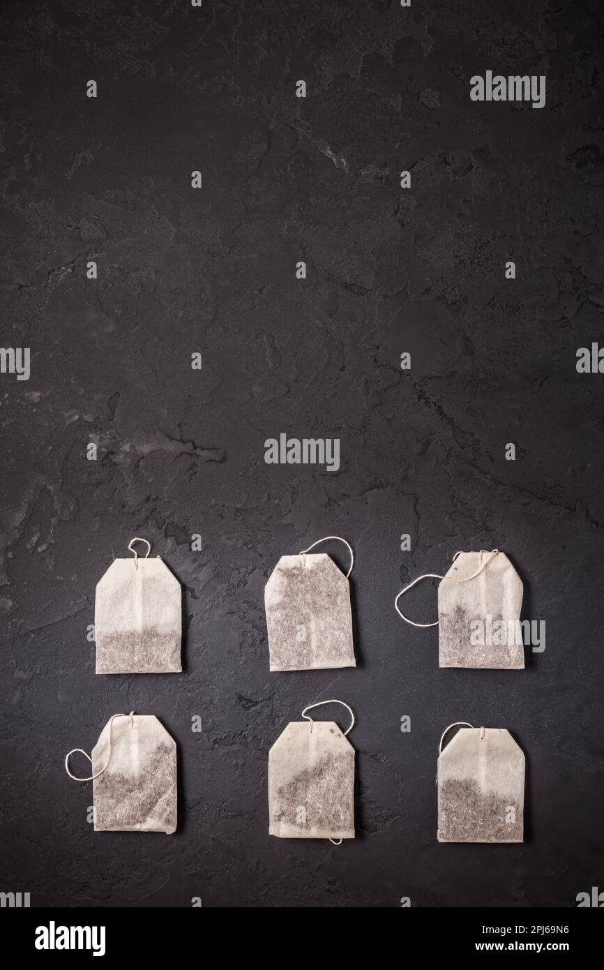 Assorted tea bags on black stone background Stock Photo - Alamy