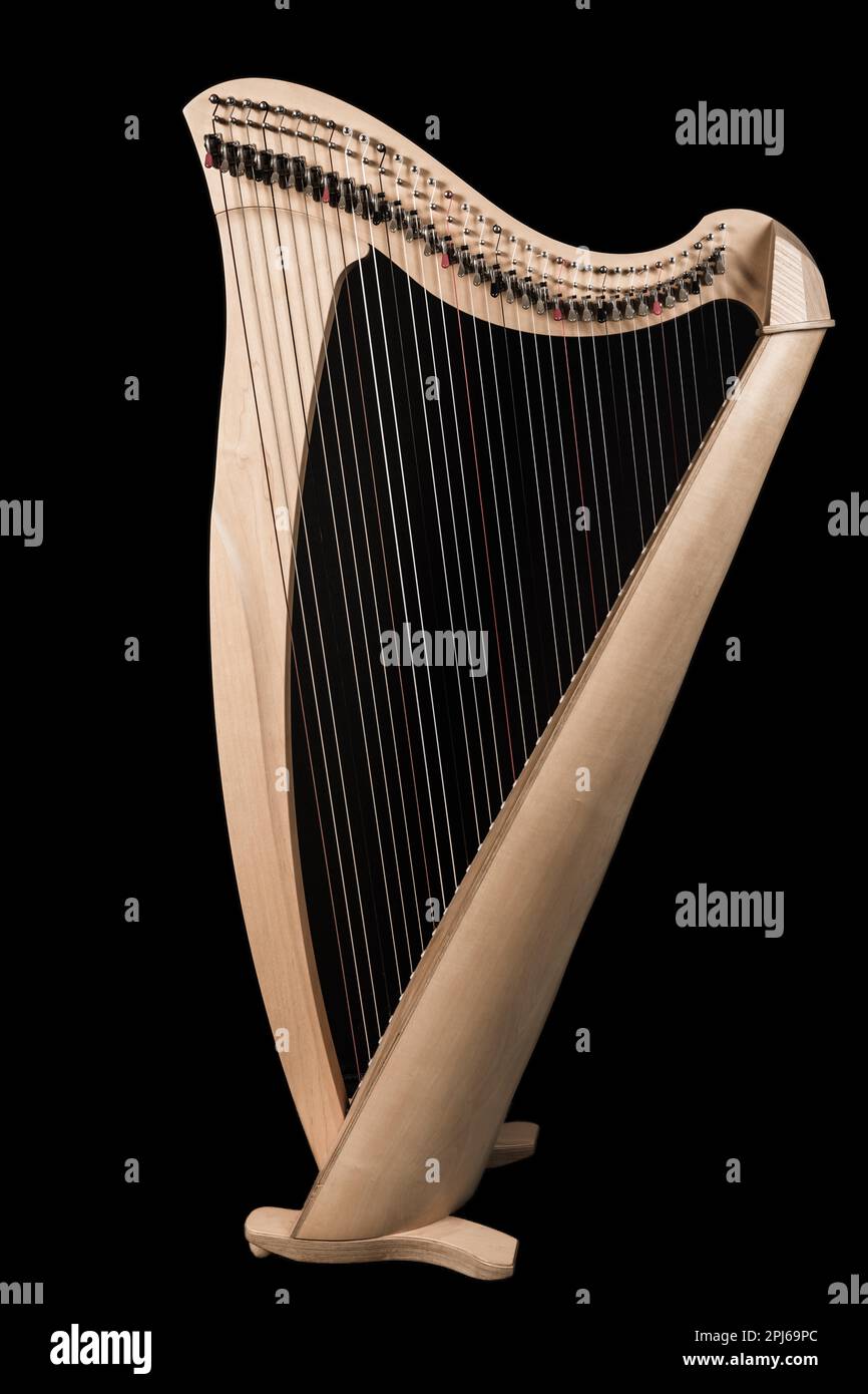 Classical wooden harp isolated on black background Stock Photo - Alamy