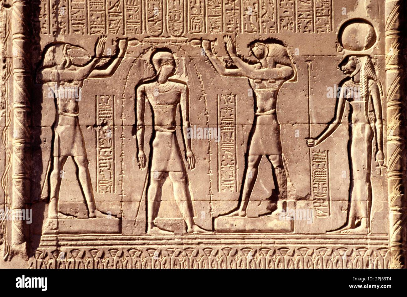 Ancient stone relief at Chnum temple of Esna in Egypt Stock Photo - Alamy