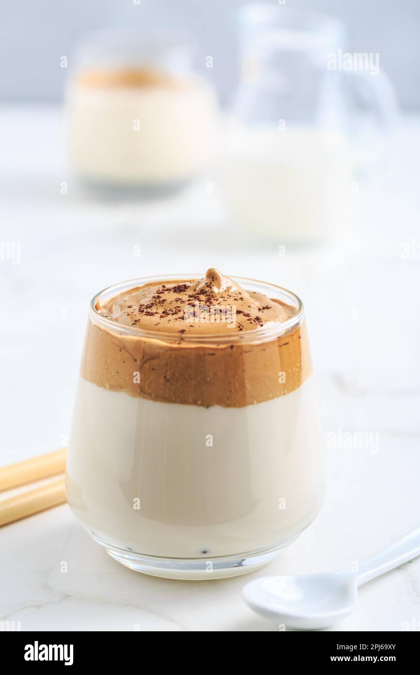 Dalgona coffee. Iced fluffy creamy whipped trend drink with coffee foam ...