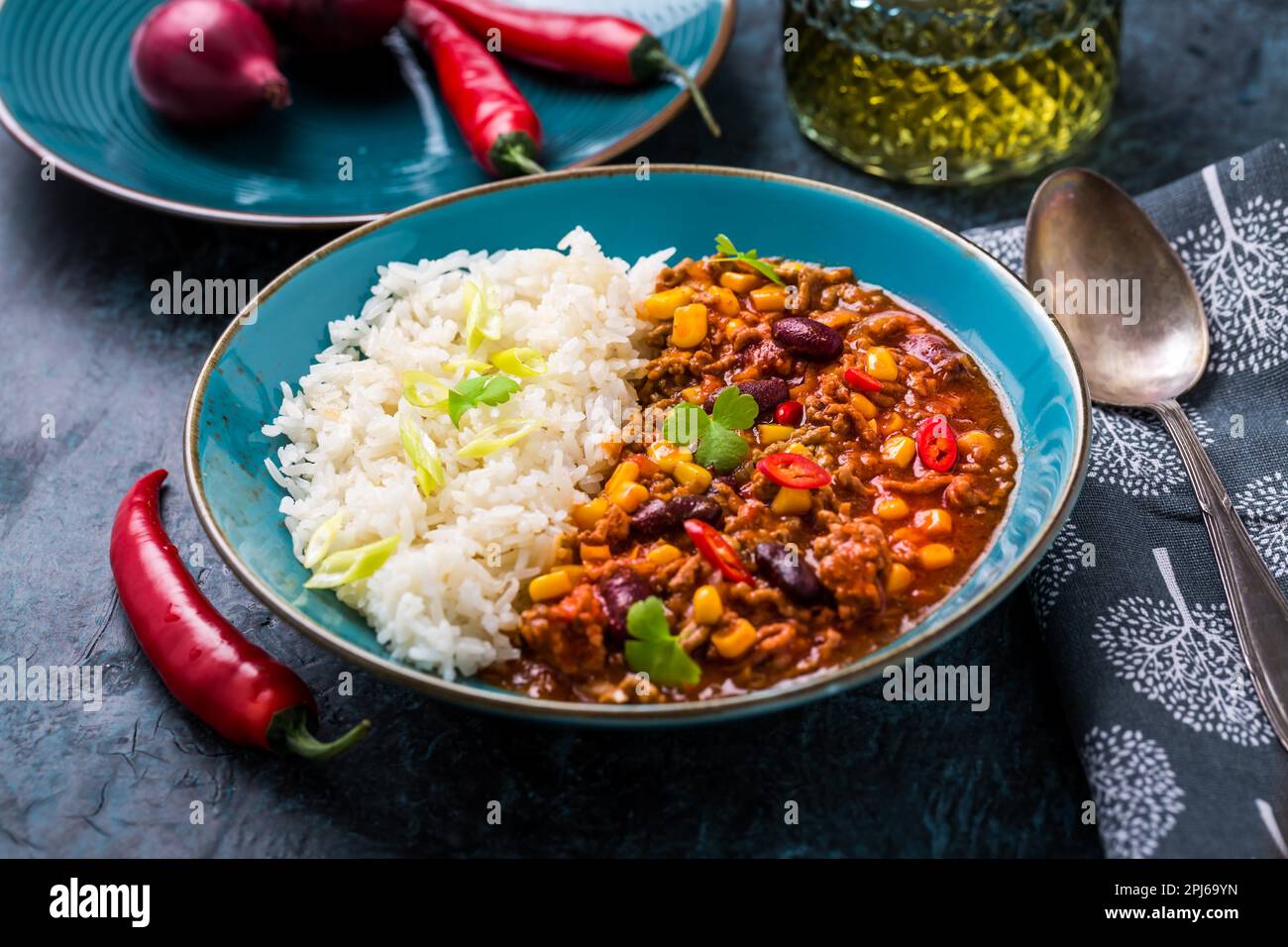 Hot Chilli con carne with rice served in bowl Stock Photo - Alamy