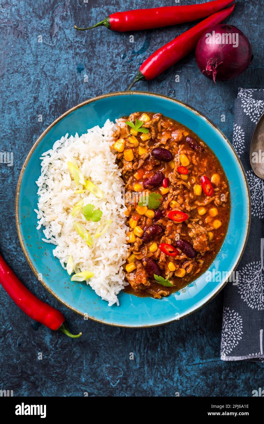 Hot Chilli con carne with rice served in bowl Stock Photo - Alamy