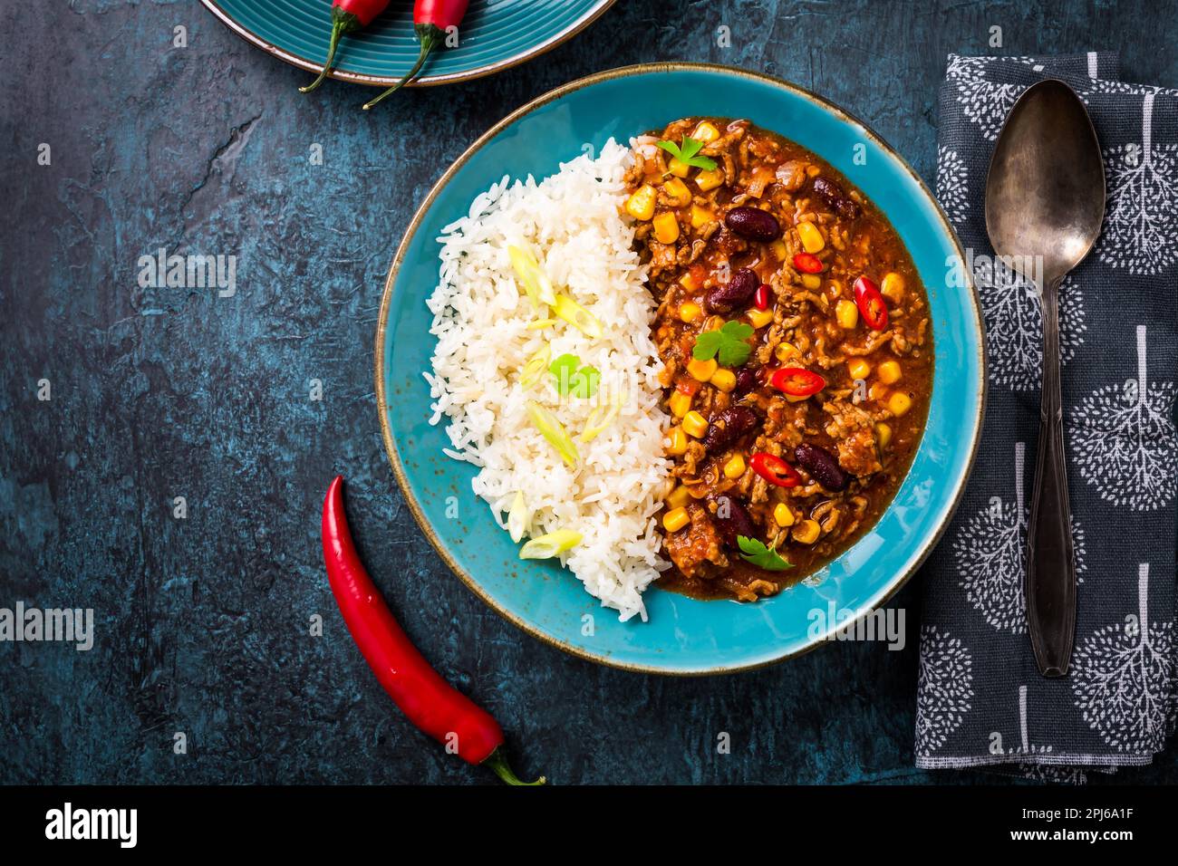 Hot Chilli con carne with rice served in bowl Stock Photo - Alamy