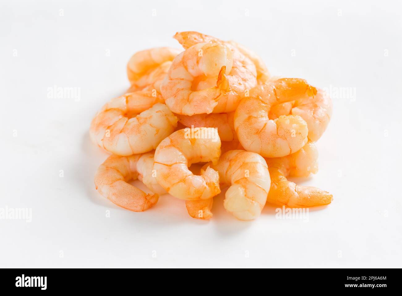 Peeled shrimps on white background Stock Photo - Alamy