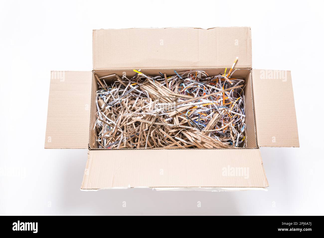 Opened cardboard box parcel with loose fill made from recyclable paper ...