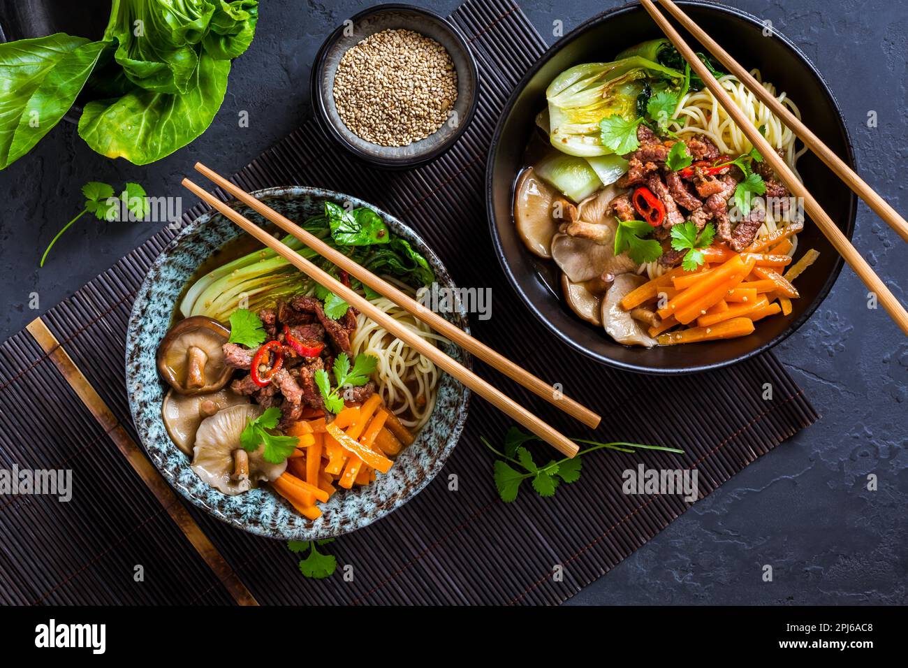 Asia style ramen soup with udon noodle, beef, shiitake, pak choi ...