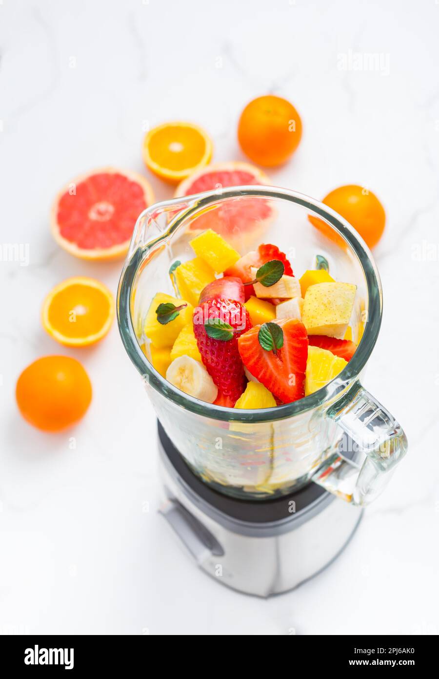 Variation of fruits in mixer. Preparing milkshake or smoothie Stock ...