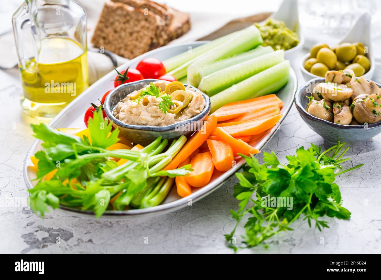 Platter of assorted fresh vegetables with avocado dip, hummus ...