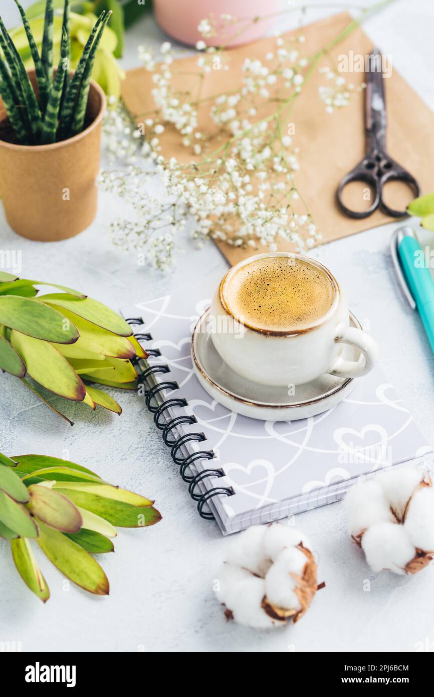 Workplace with cup of coffee, plants and notebook. Ideas for your ...
