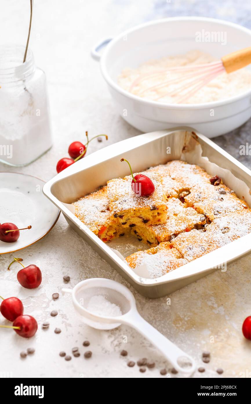 Homemade cherry sponge cake with chocolate drops with ingredients Stock ...