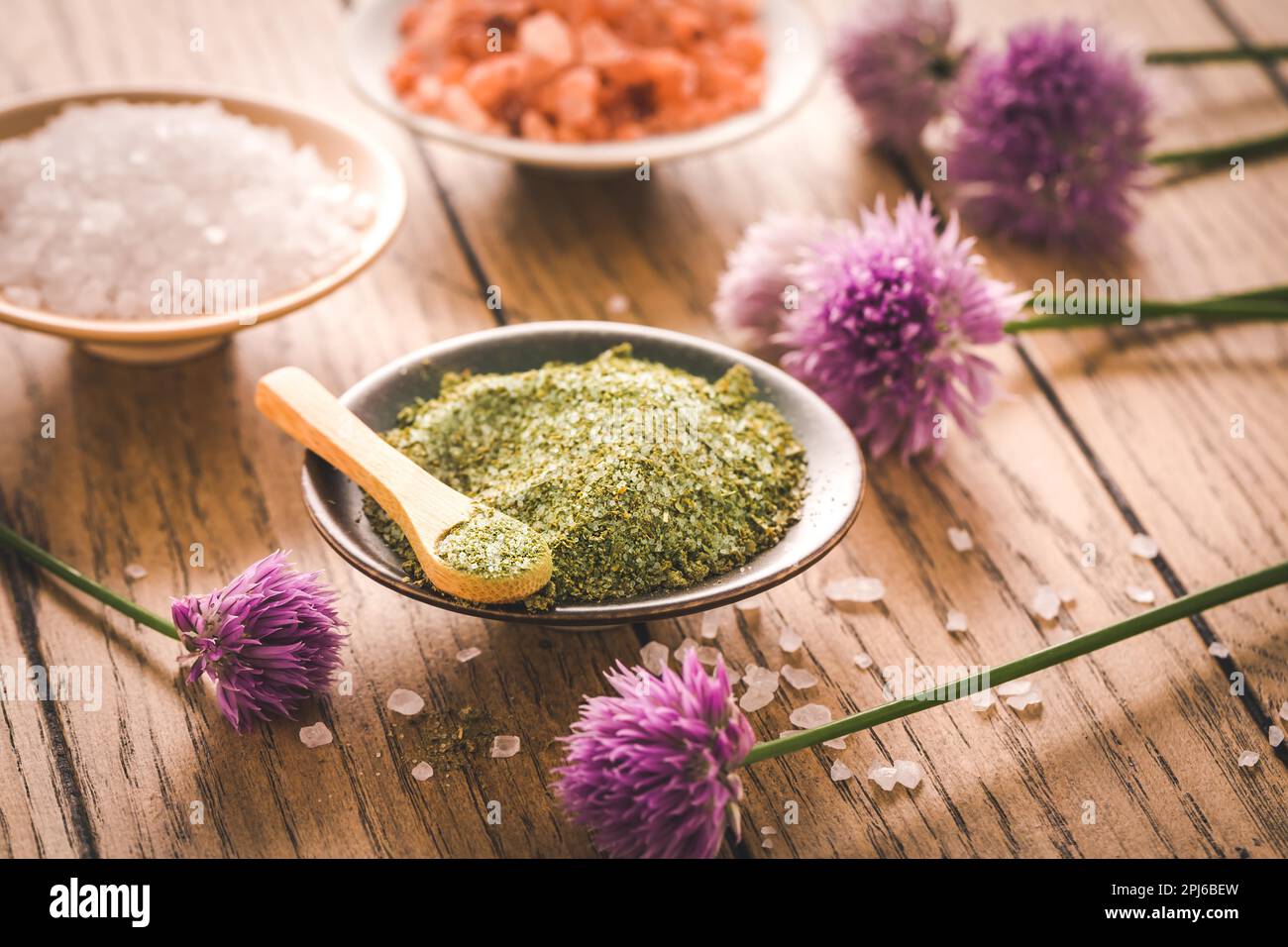 Assortment of salts in bowls : white rock salt, Himalayan salt and ...