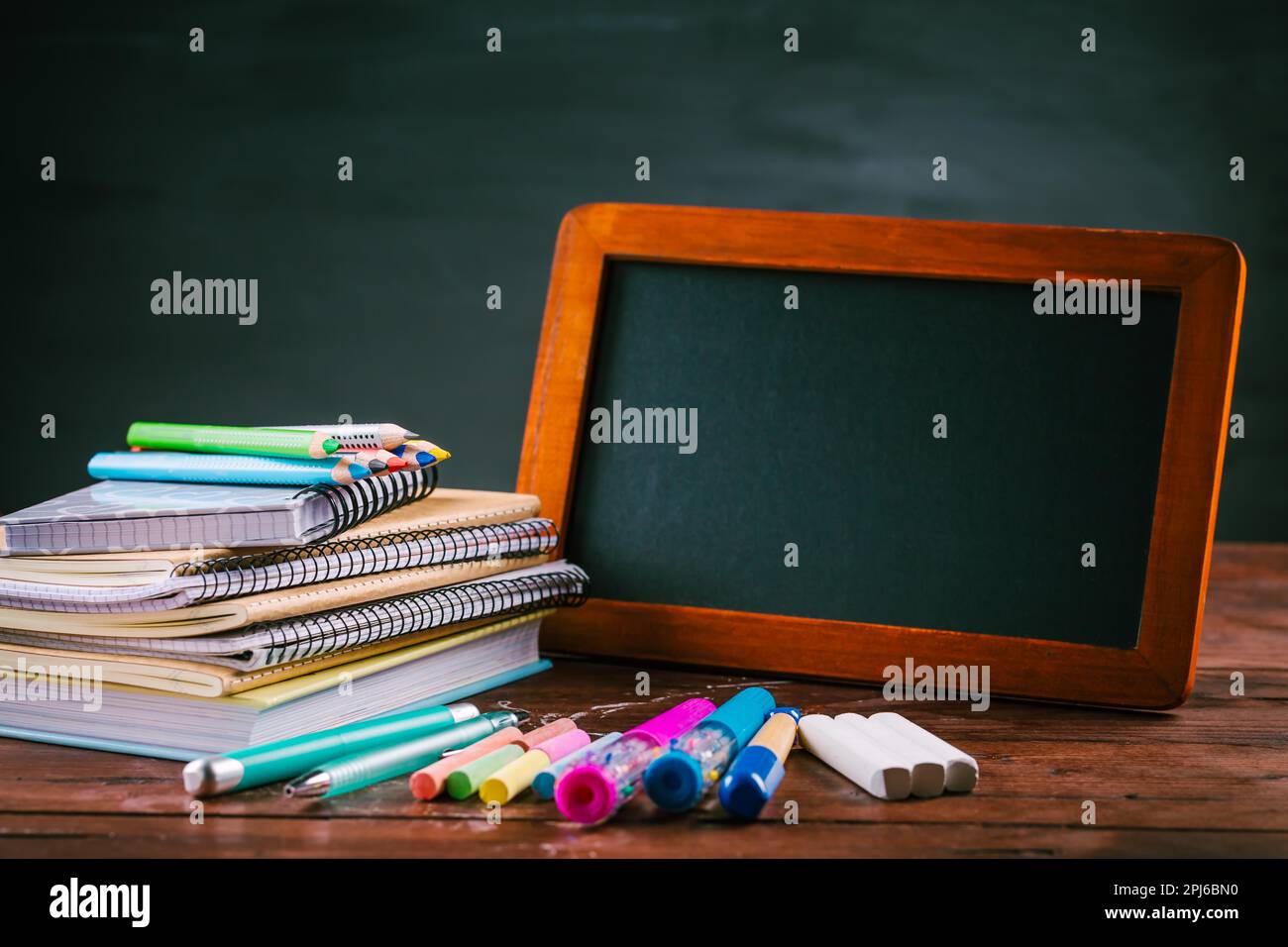 Pile of book and exercise books with school applies and apple snack ...