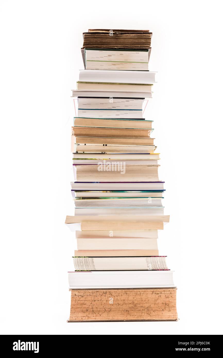 Pile of old and new books isolated on white background Stock Photo - Alamy